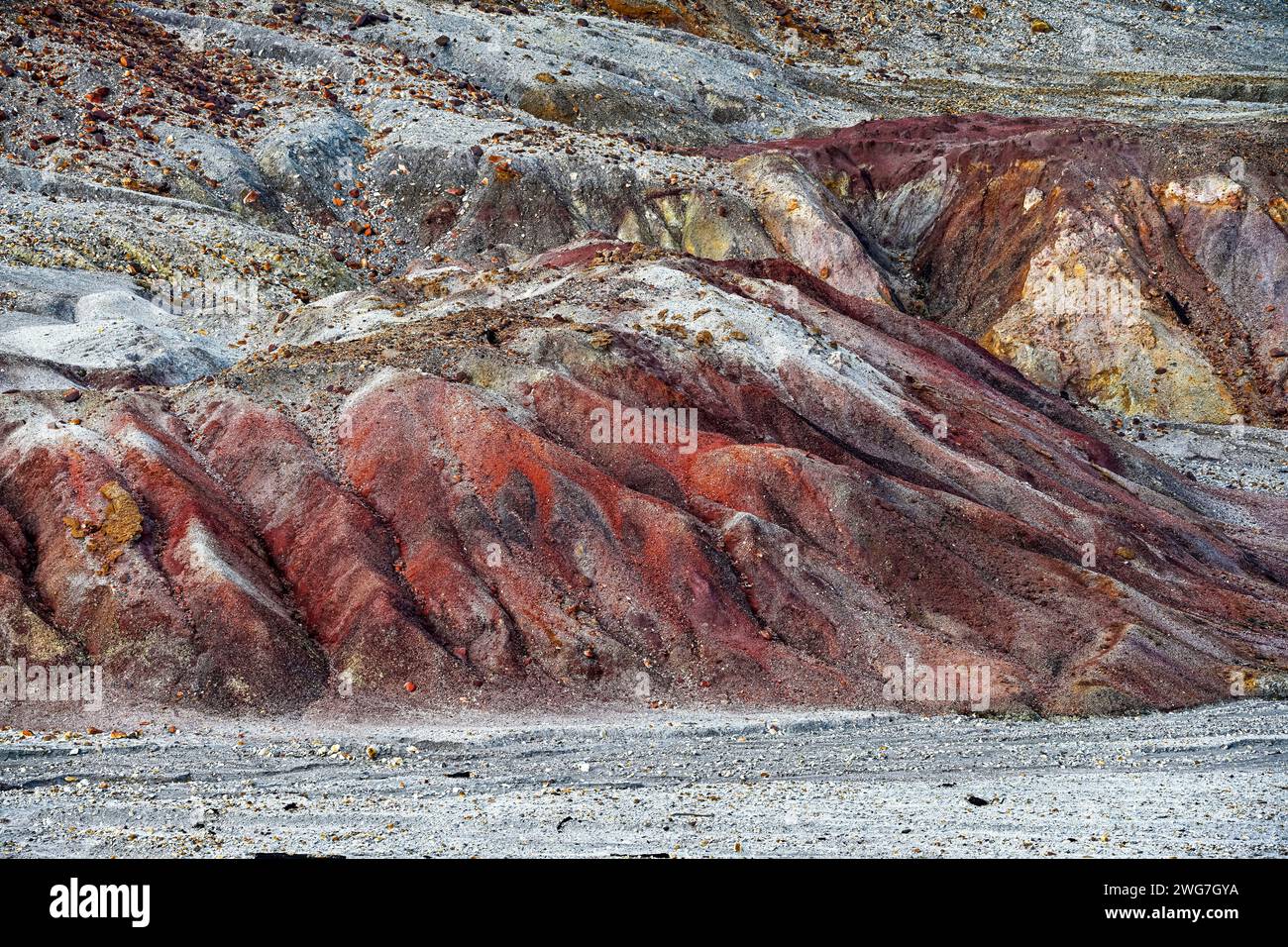 Detailed view of the earthy red and brown striated mineral layers in ...