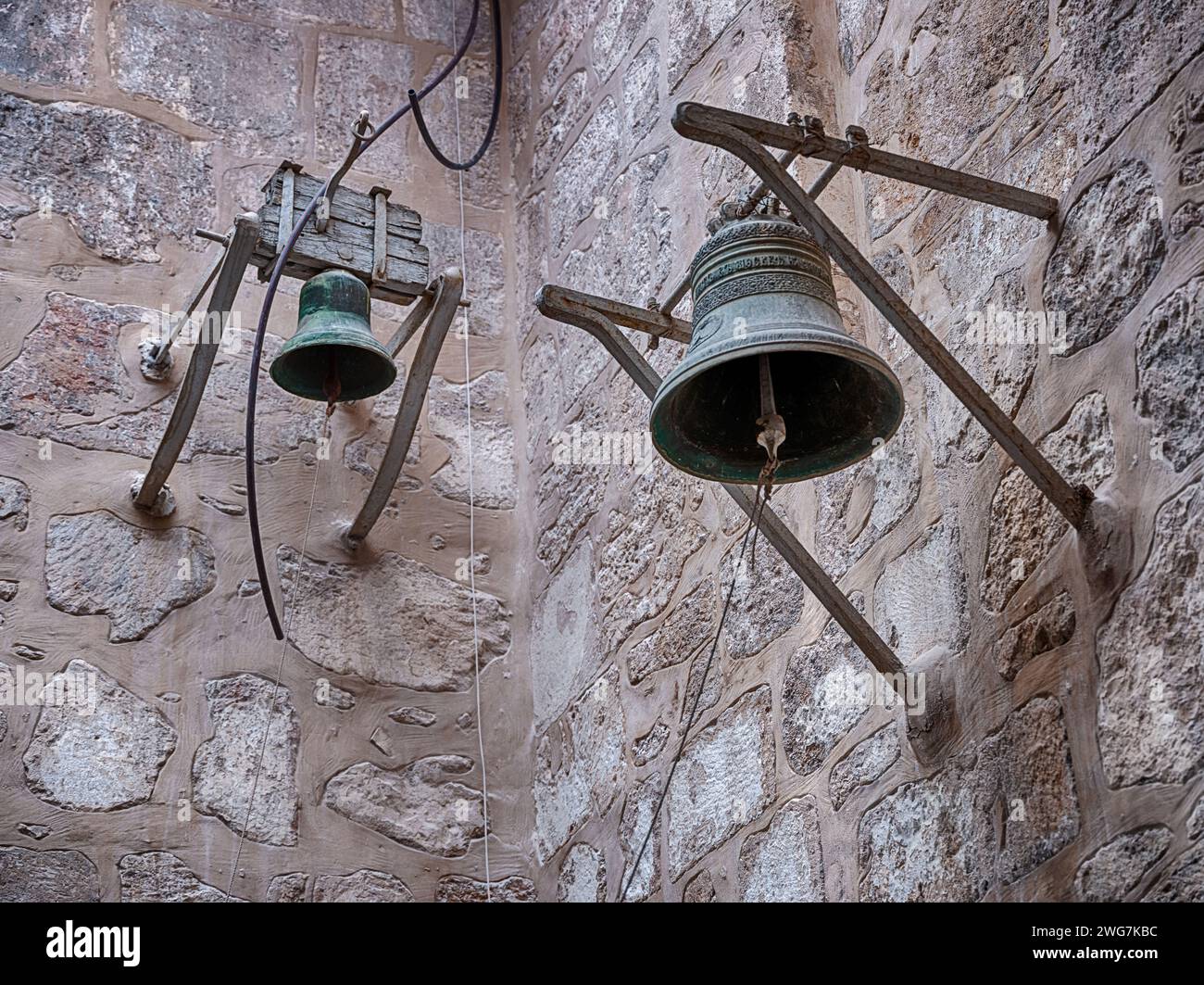 Two bronze bells hang from the walls inside the historic Chapel of St ...