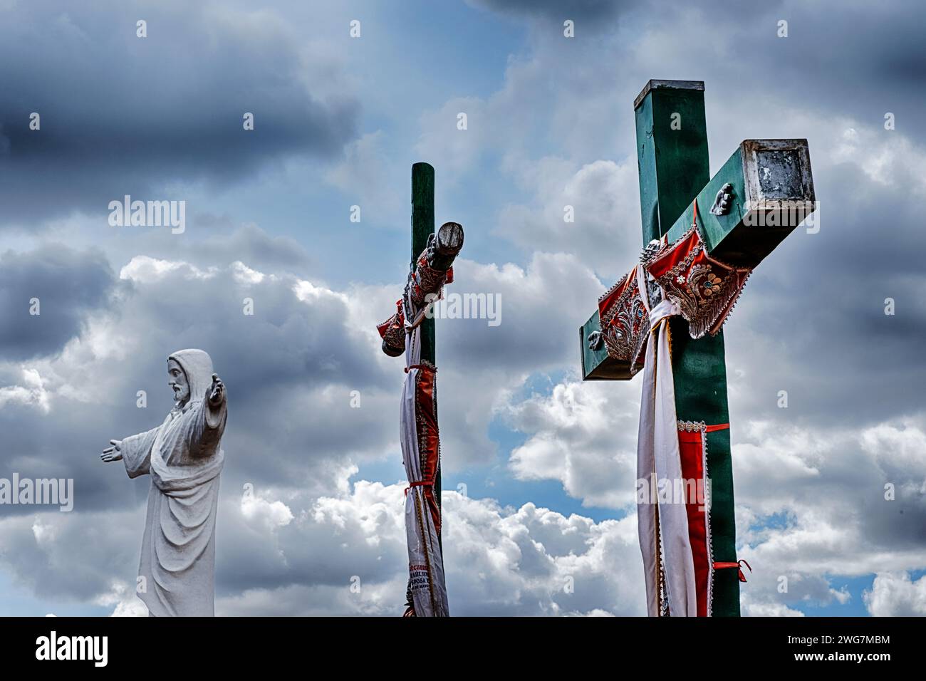 The White Christ of Pukamoqo next to several large crosses looks out ...