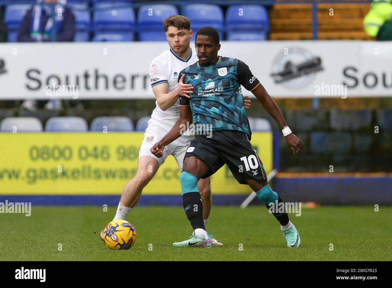 Birkenhead, UK. 03rd Feb, 2024. Connor Wood of Tranmere Rovers (l) and ...