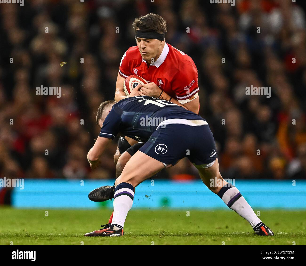 Teddy Williams of Wales is tackled by Finn Russell of Scotland during ...