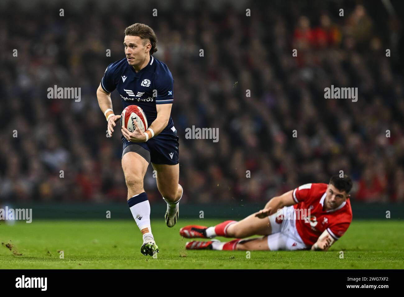 Kyle Rowe of Scotland makes a break during the 2024 Guinness 6 Nations ...