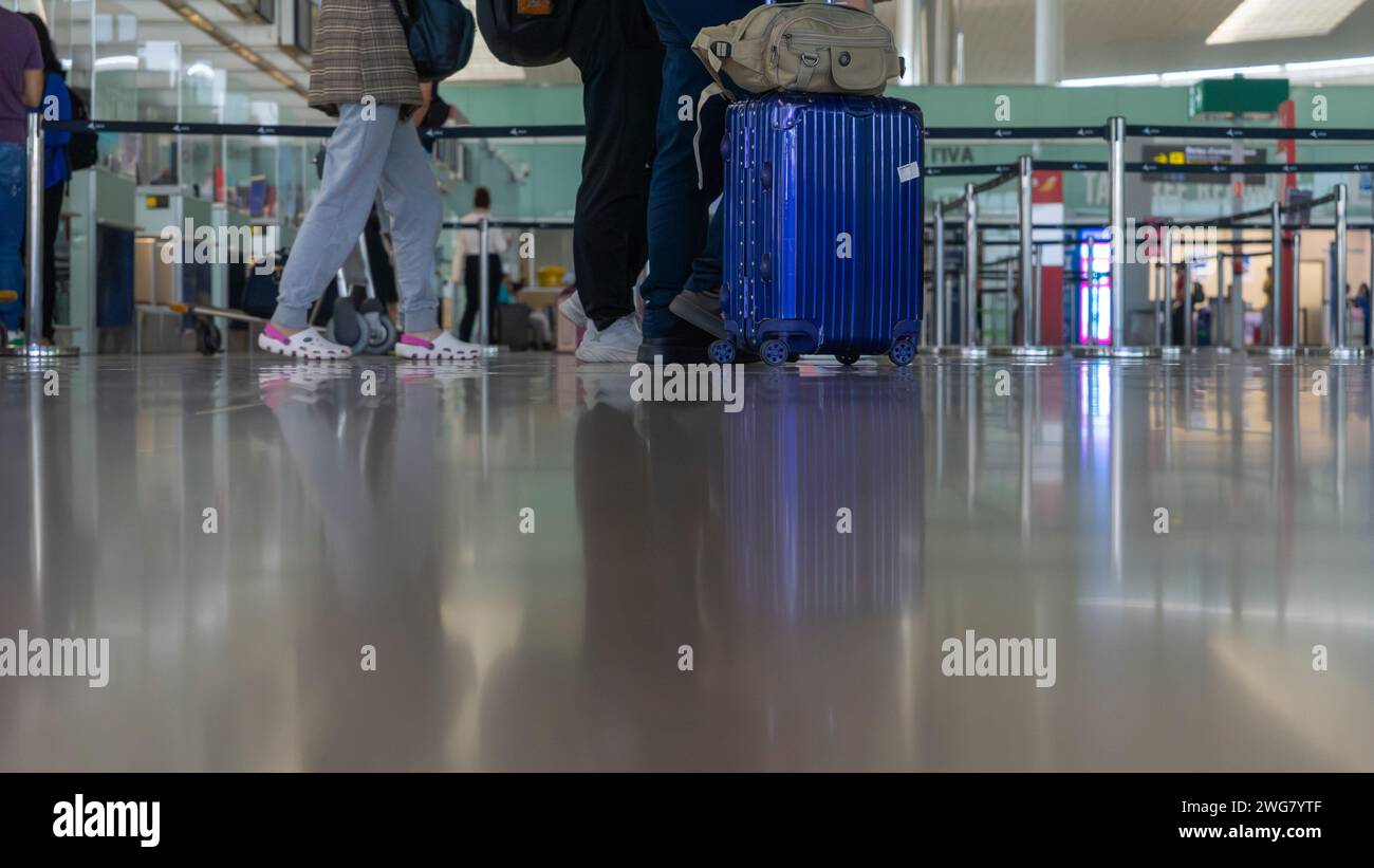 Ground Perspective of Busy Airport Terminal with Passengers and Luggage ...