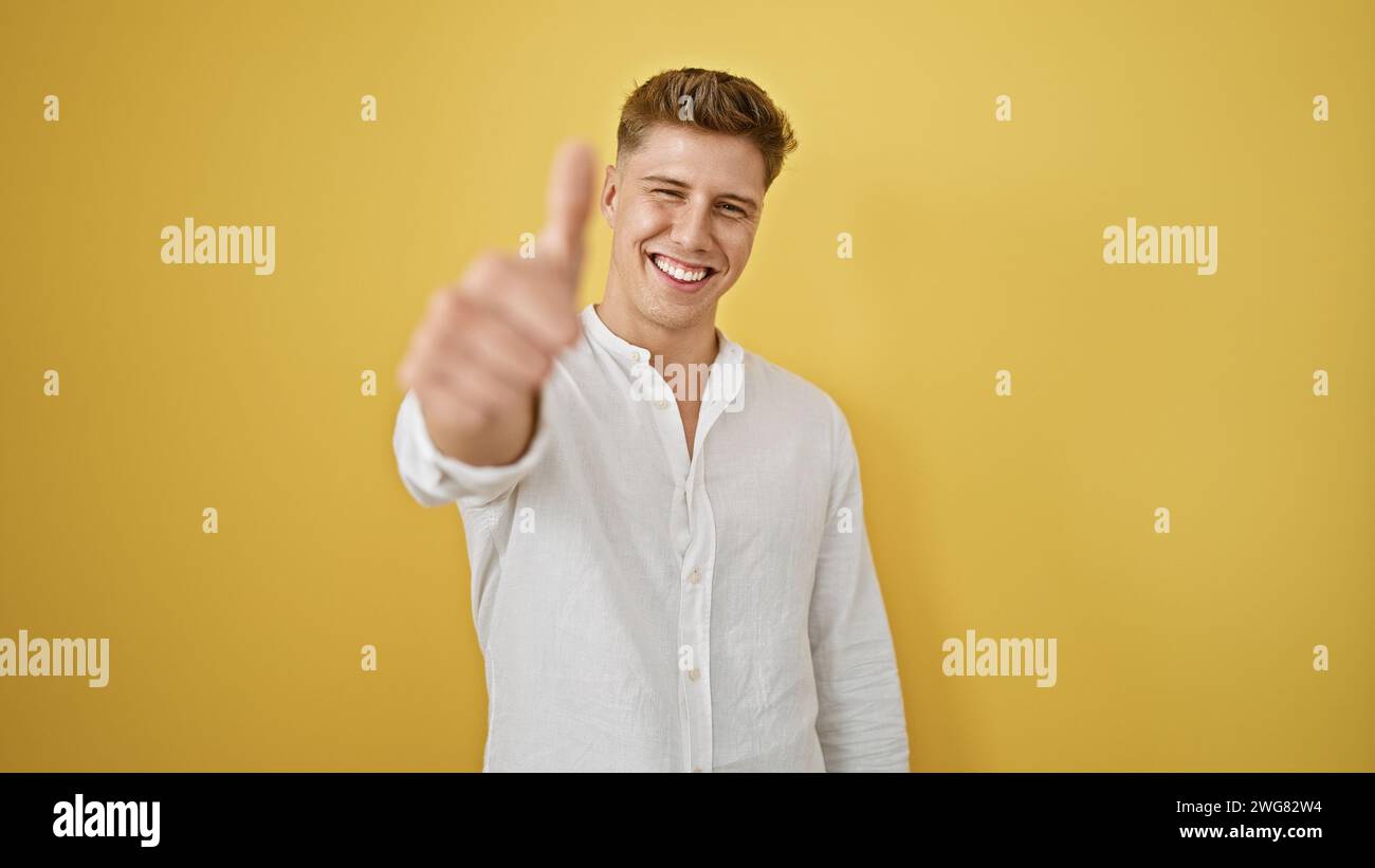Happy young caucasian man, confidently standing, flashing a huge ...