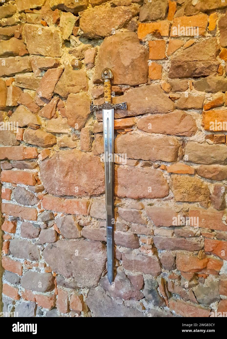 Knight old sword on the wall in an old castle in an operating coffee ...