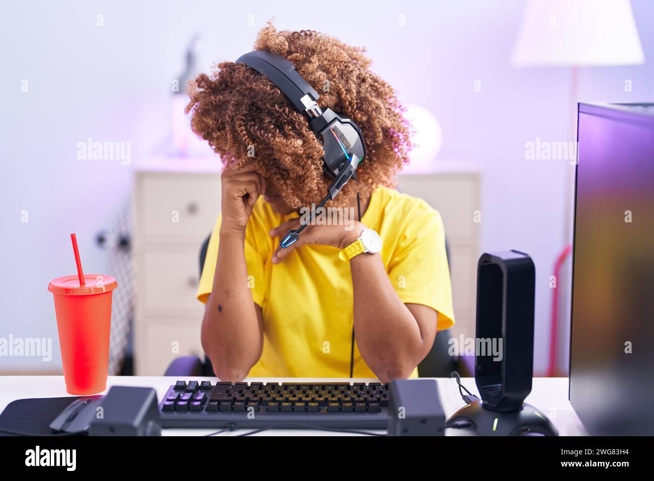 Tired female gamer playing video games hi-res stock photography and ...
