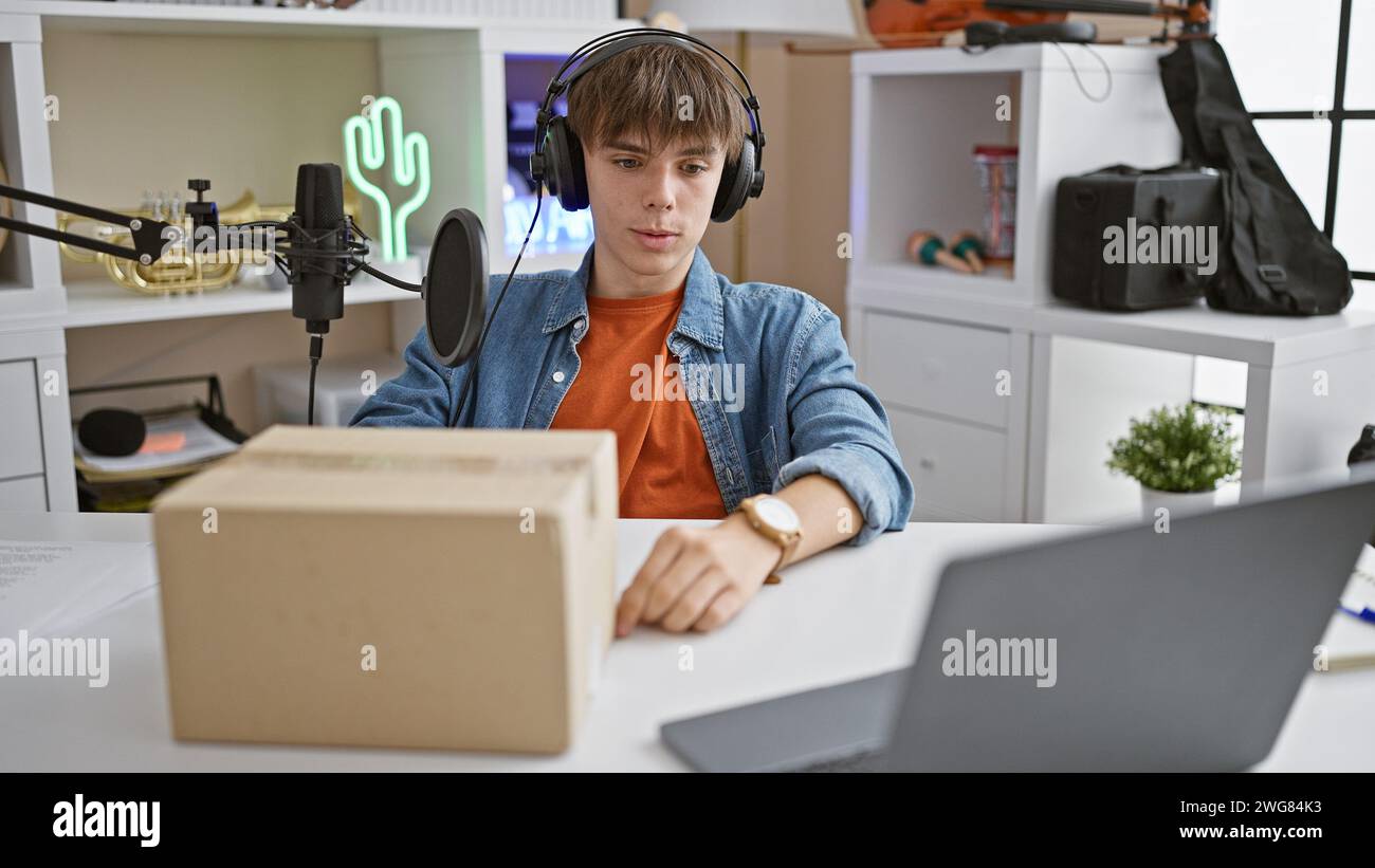 A teenage boy podcasts at a home studio setup with a microphone ...