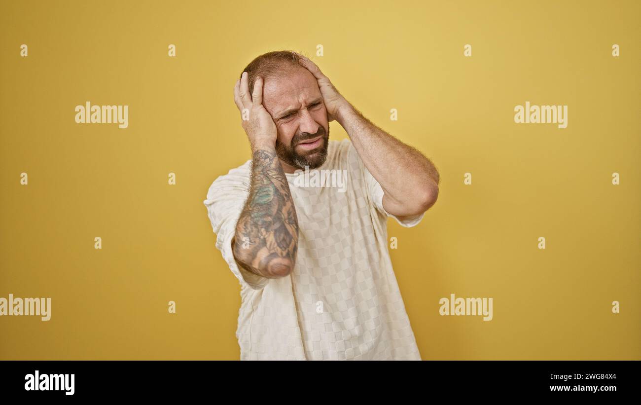 Handsome young man, full of despair and frustration, stands alone ...