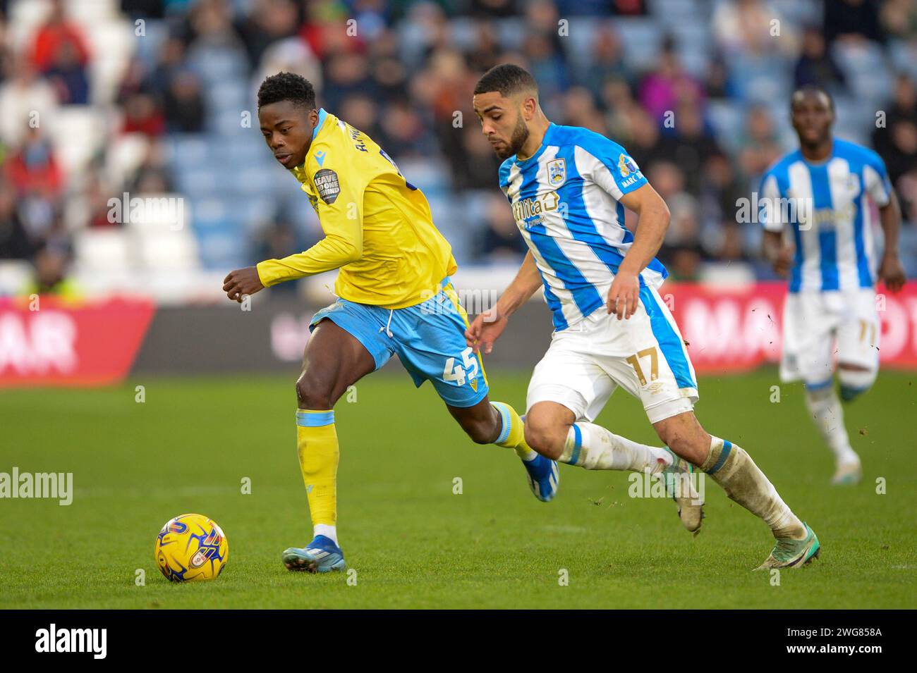 Anthony Musaba of Sheffield Wednesday is under pressure from Brodie ...