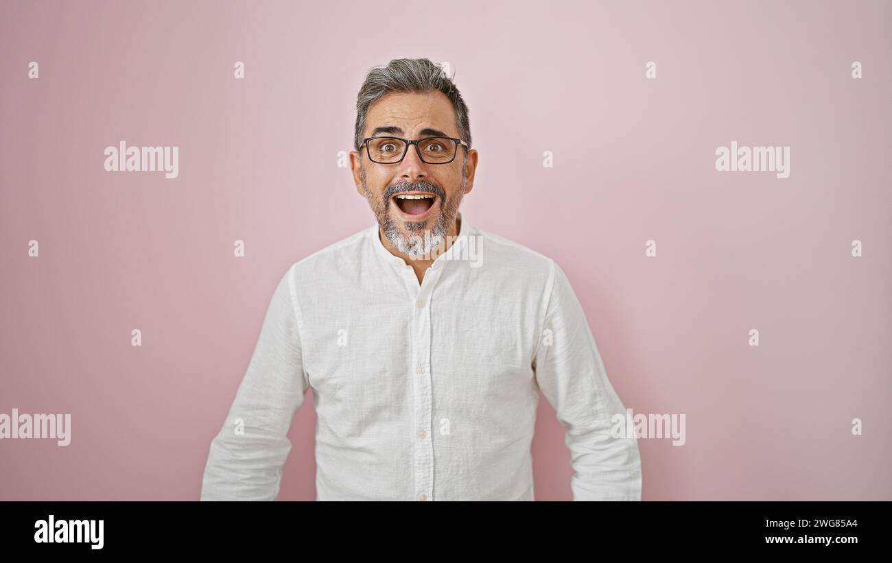 Oh wow! grey-haired young hispanic man with surprising expression ...