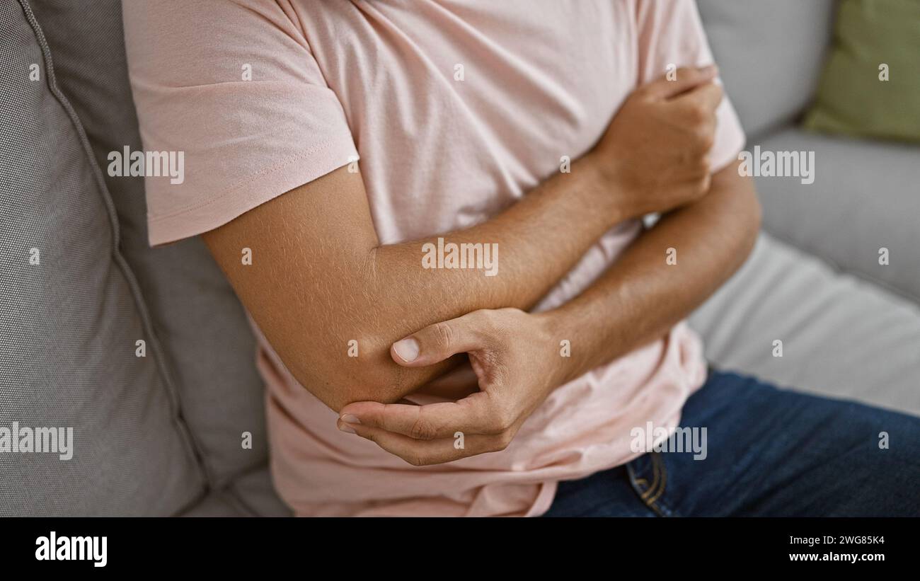 Elbow pain hispanic hi-res stock photography and images - Alamy