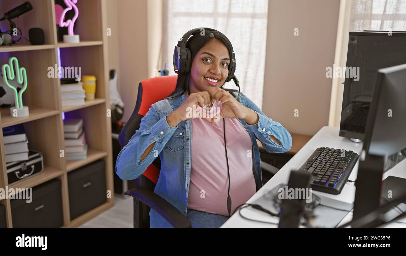 Belly-braced young latin mother-to-be, a beaming streamer, lovingly ...