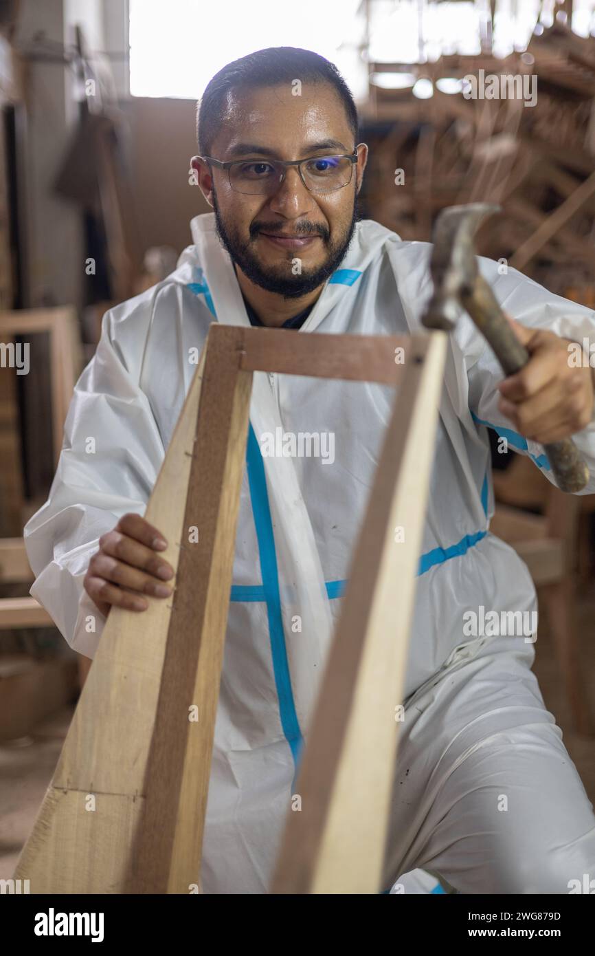 Young man with hammer hi-res stock photography and images - Alamy
