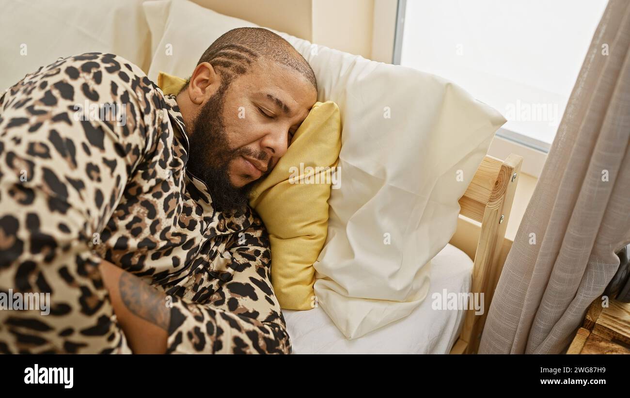 African american man with beard sleeping in bedroom indoors Stock Photo ...