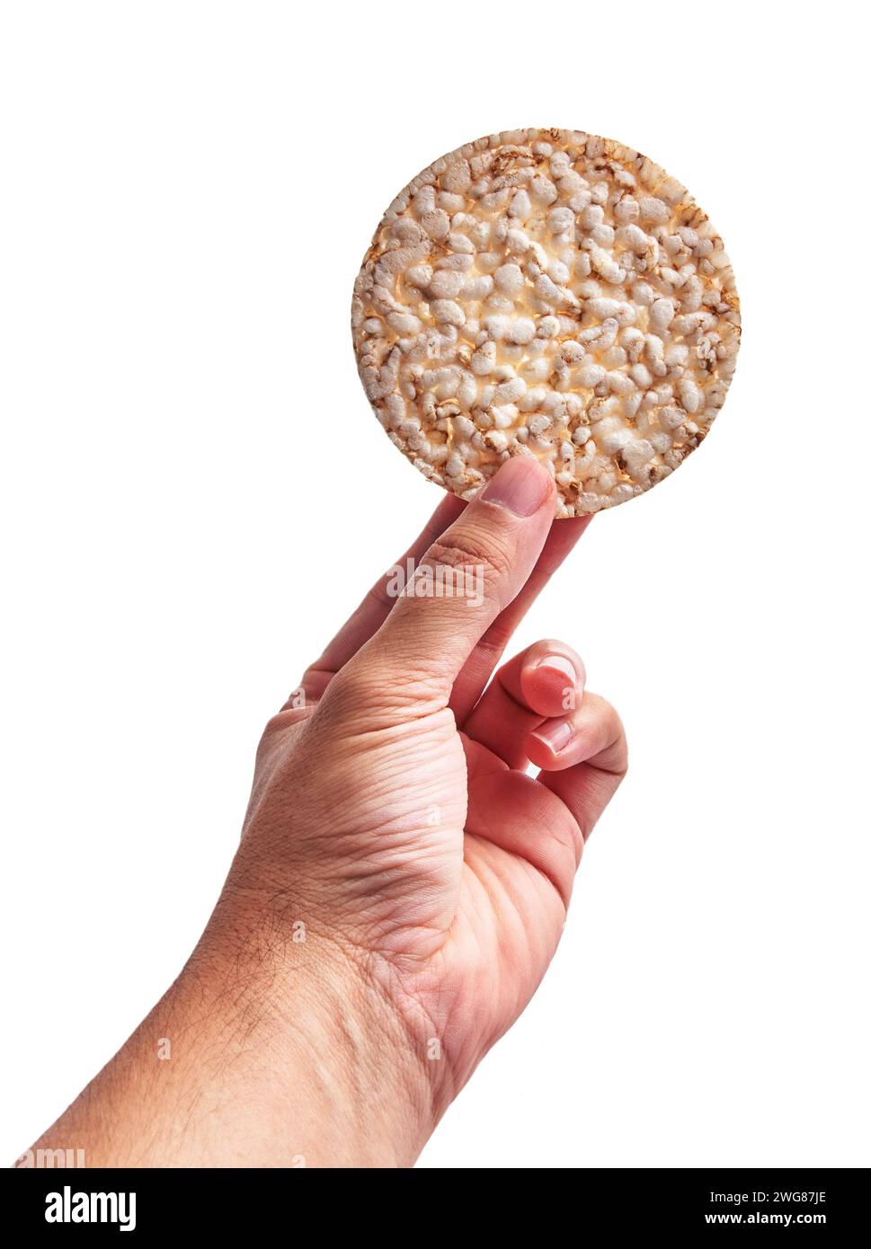Hand of man holding single rice cake over isolated white background ...