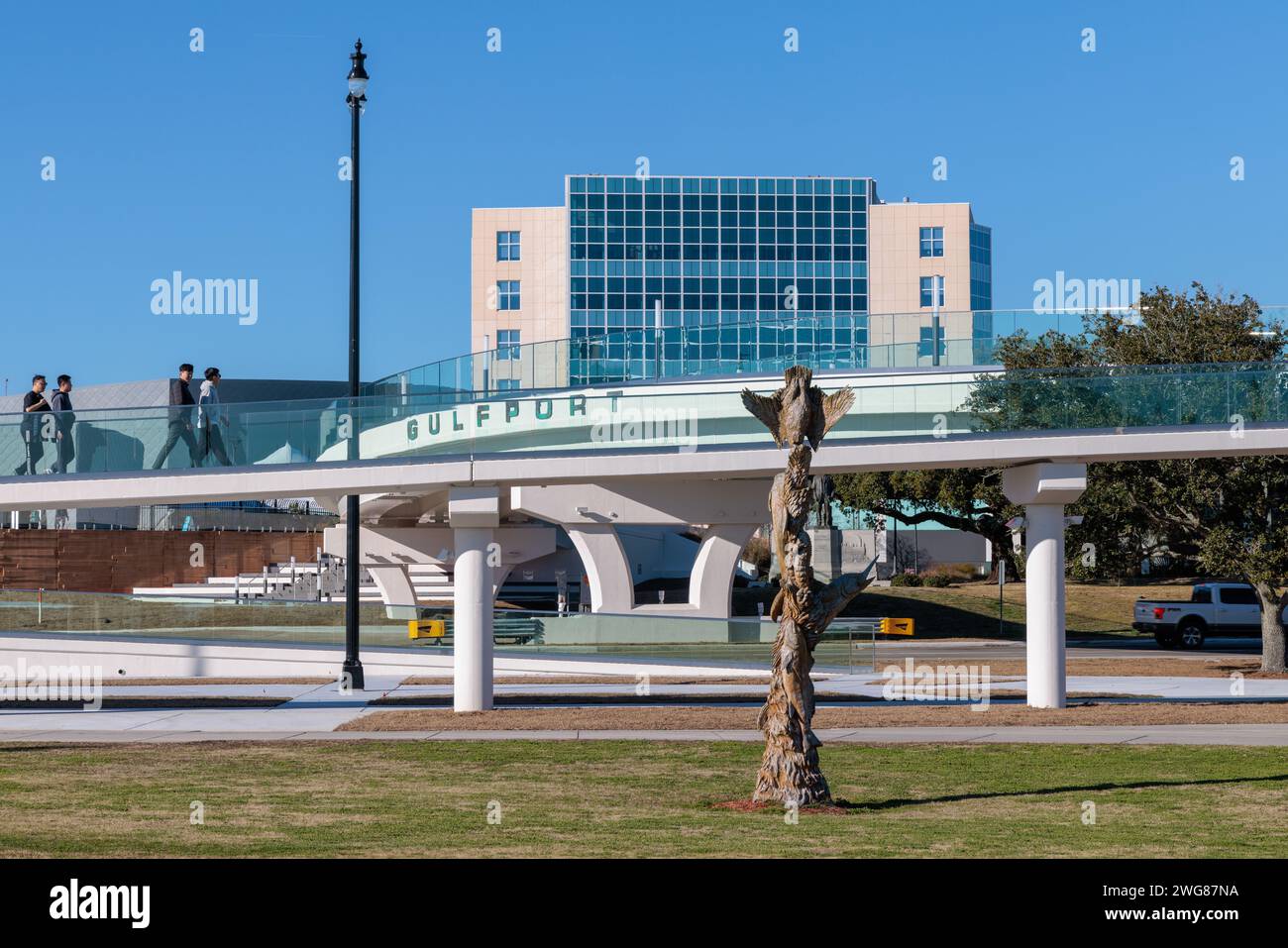 Jones Park visitors walking on new pedestrian bridge that takes people across Highway 90 to the ...