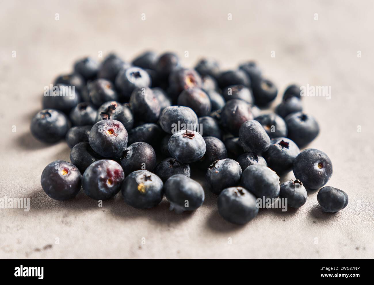 Delicious group of blueberries marble surface Stock Photo - Alamy