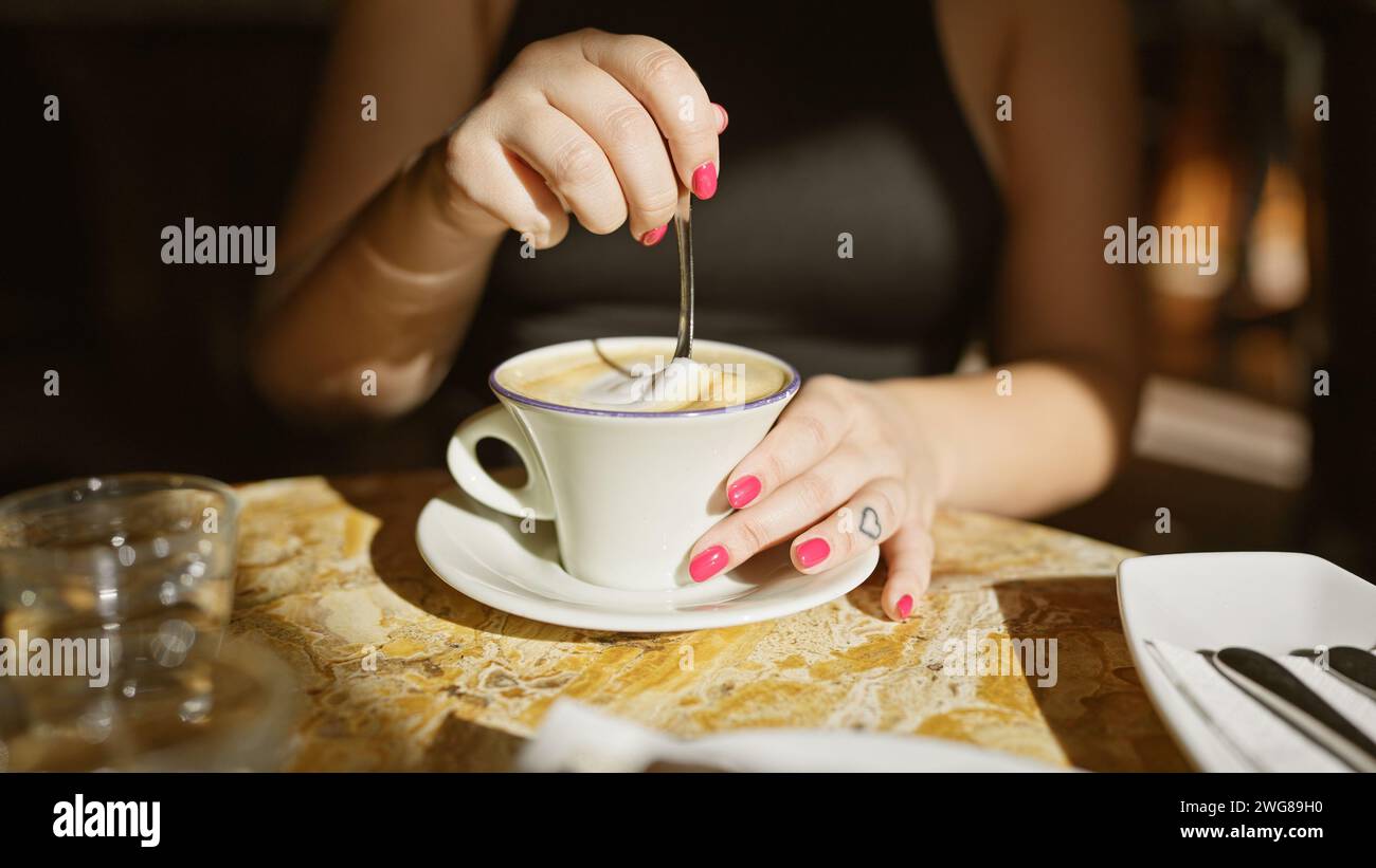 Woman stirs cup coffee coffee hi-res stock photography and images - Alamy