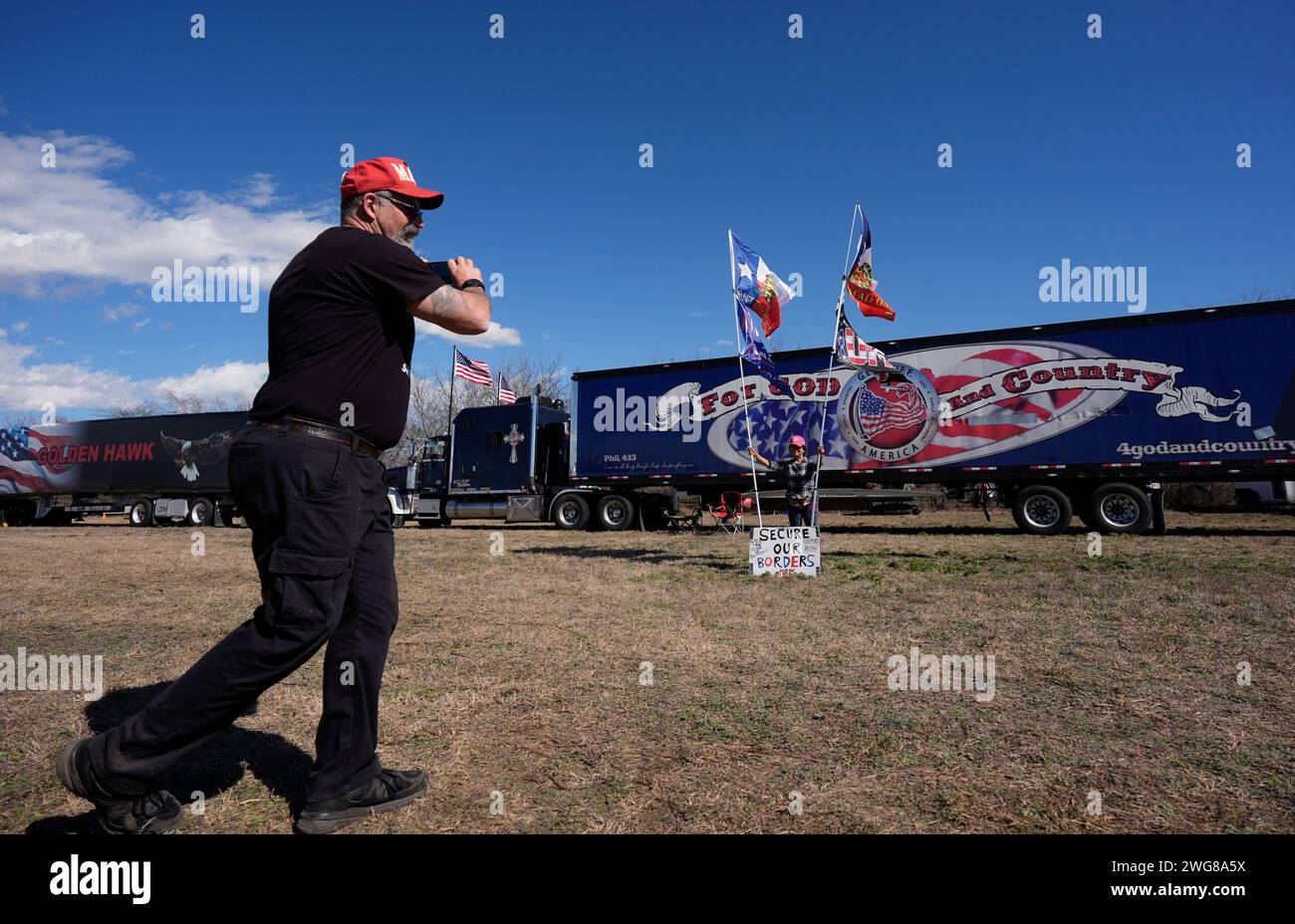 Phill Cady, left, takes a photo of his wife, Nina, during a "Take Our ...