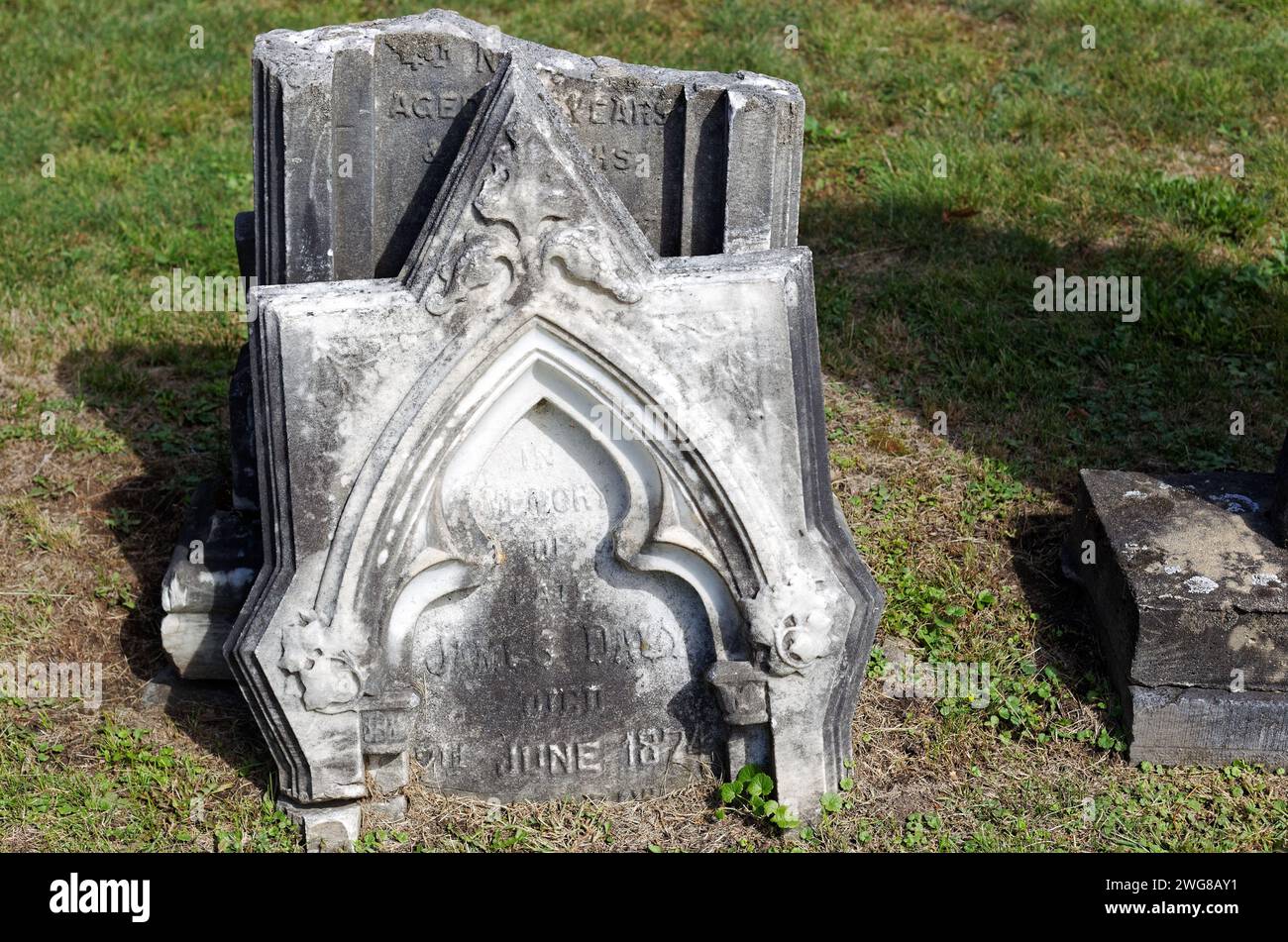 An old broken tombstone in a graveyard, Rawdon,Quebec,Canada Stock ...
