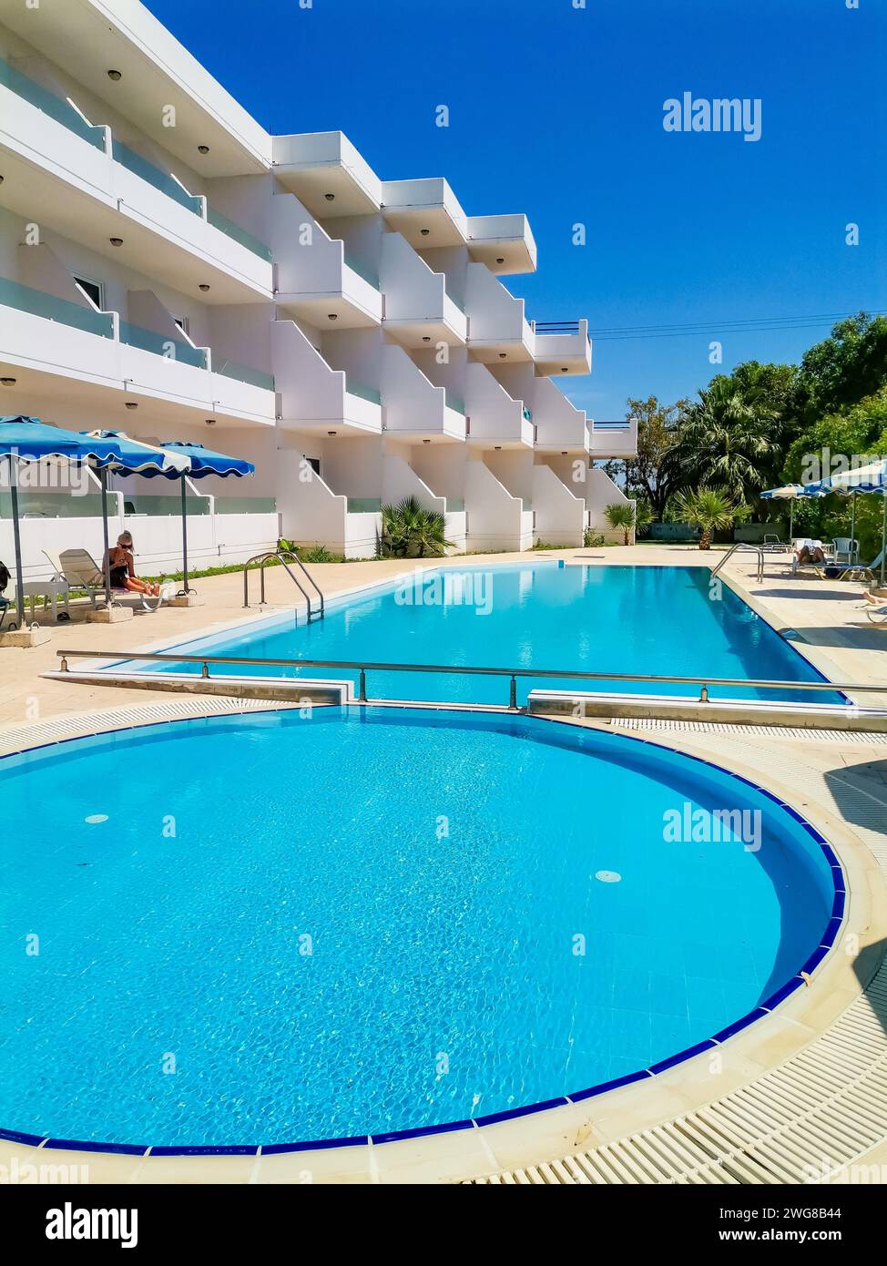 Luxury swimming pools in a modern hotel sunny day Greece Rhodos Stock ...
