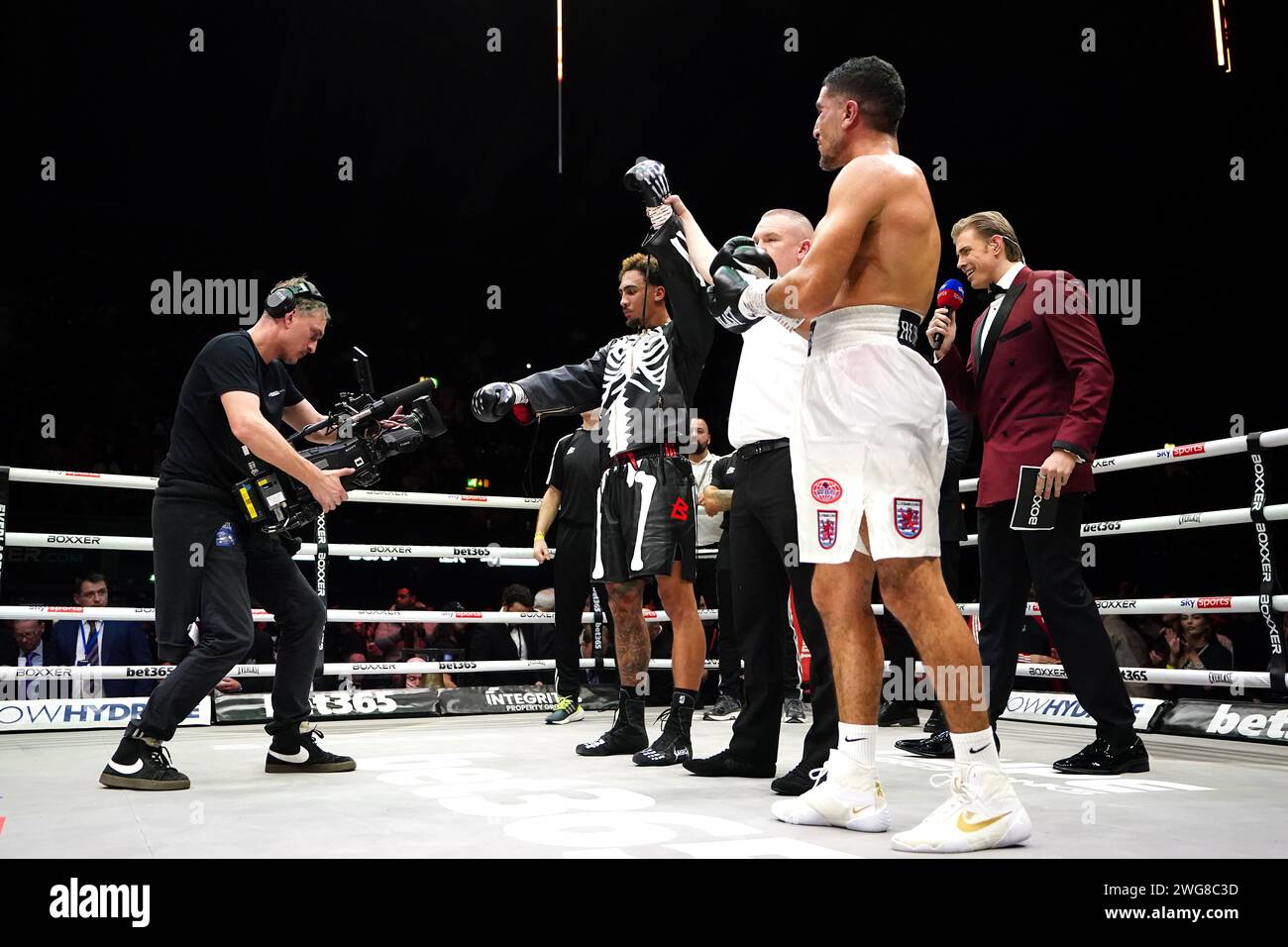 Ben Whittaker (centre) celebrates victory via KO against Khalid Graidia ...