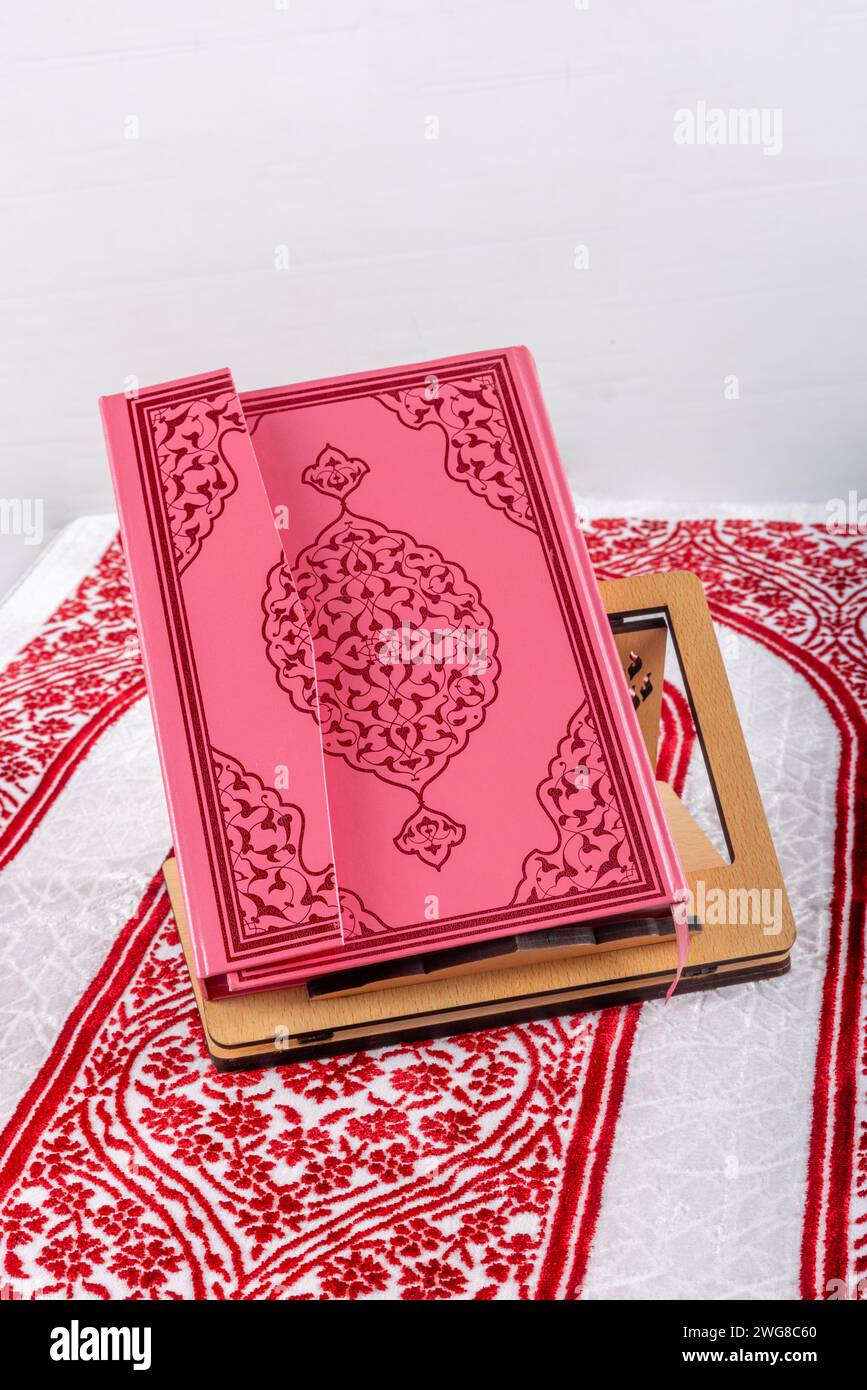 Istanbul, Türkiye - January 28, 2024; Quran on prayer mat. Quran and ...