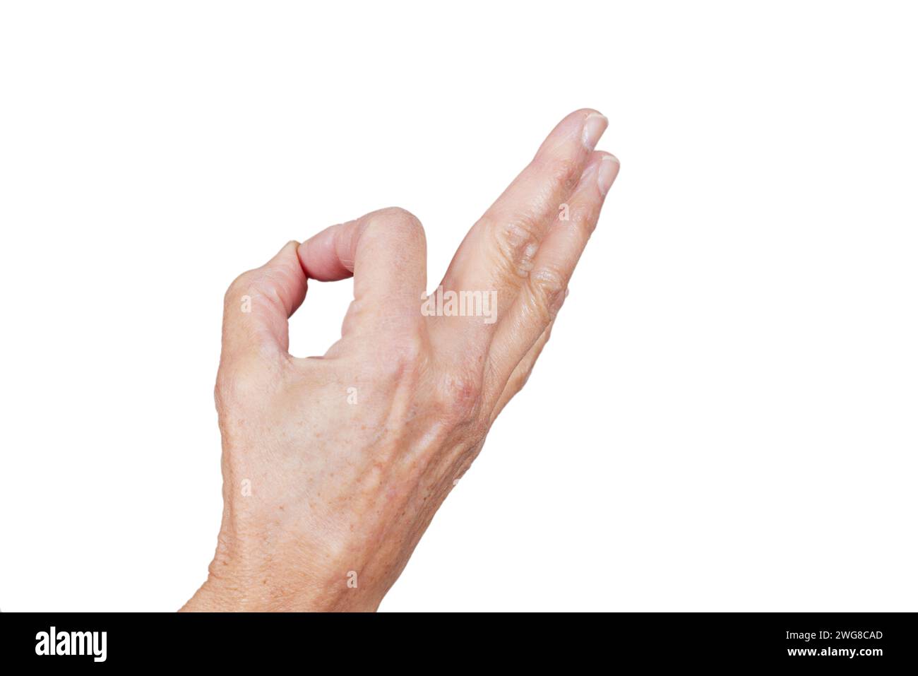 Close up of a hand with the thumb and forefinger together to form a ...