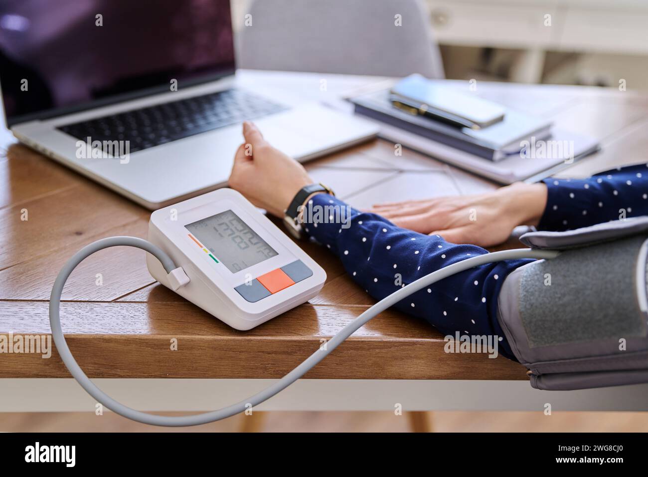 Close-up of woman's hand measuring blood pressure with tonometer Stock ...