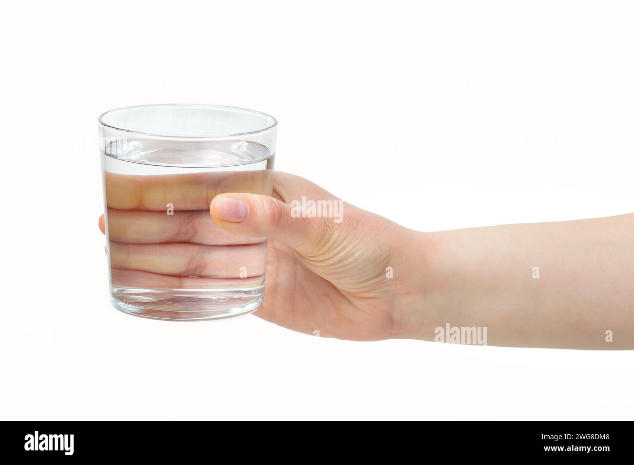 Woman hand holding a glass with water isolated on a white background ...
