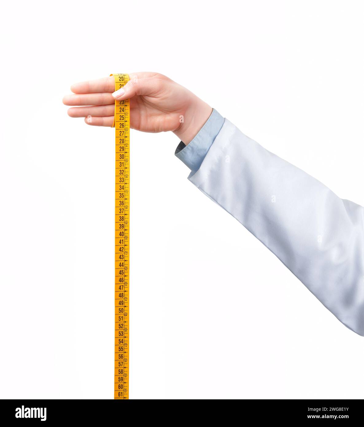 Shot of a doctor hand holding a tape measure on a white isolated ...