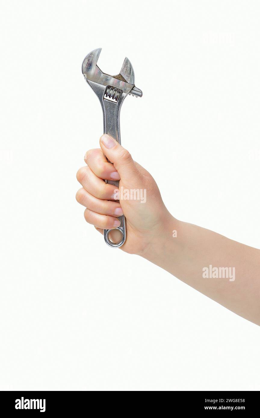 Woman hand holding a spanner isolated on a white background Stock Photo ...