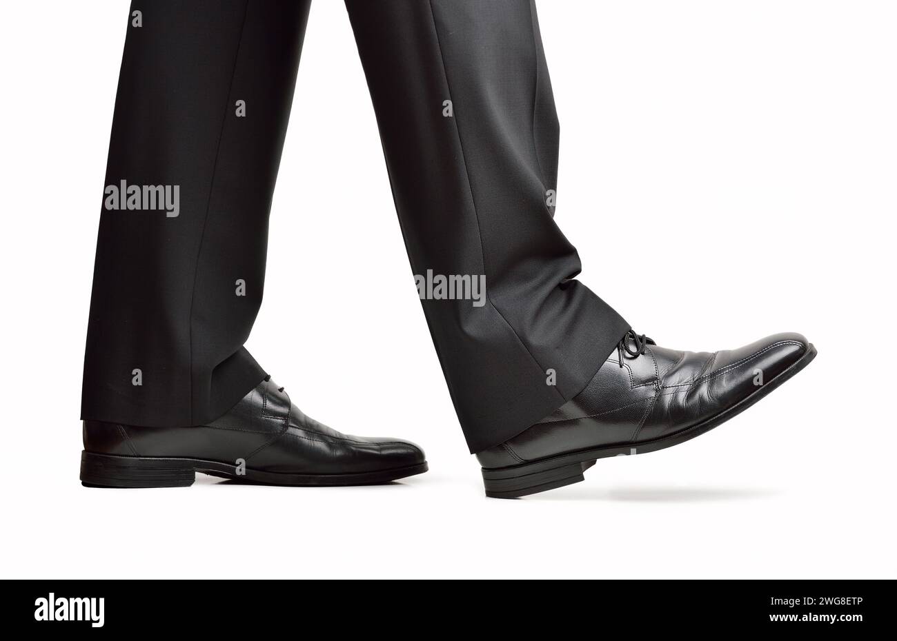 Close up of steps of a businessperson walking with isolated on white ...