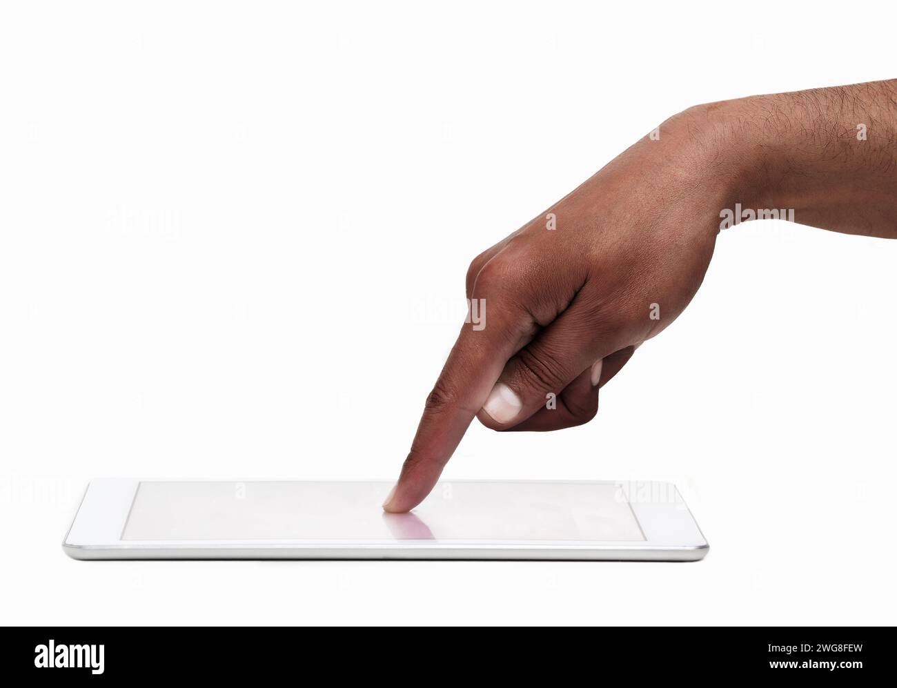 Cropped closeup of a man's hand above a digital tableton and a white ...