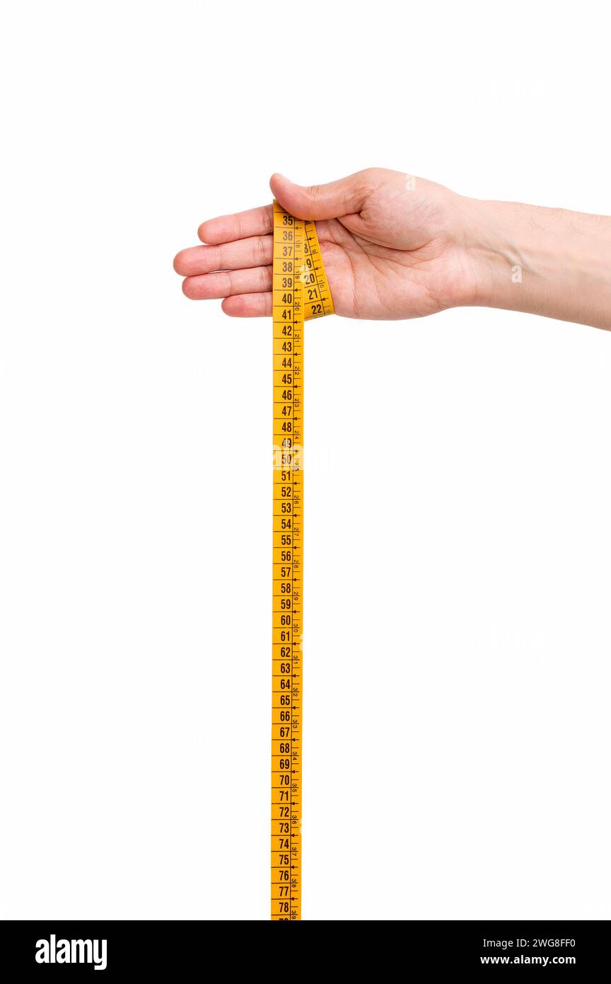 Man hand holding a tape measure on a white isolated background Stock ...