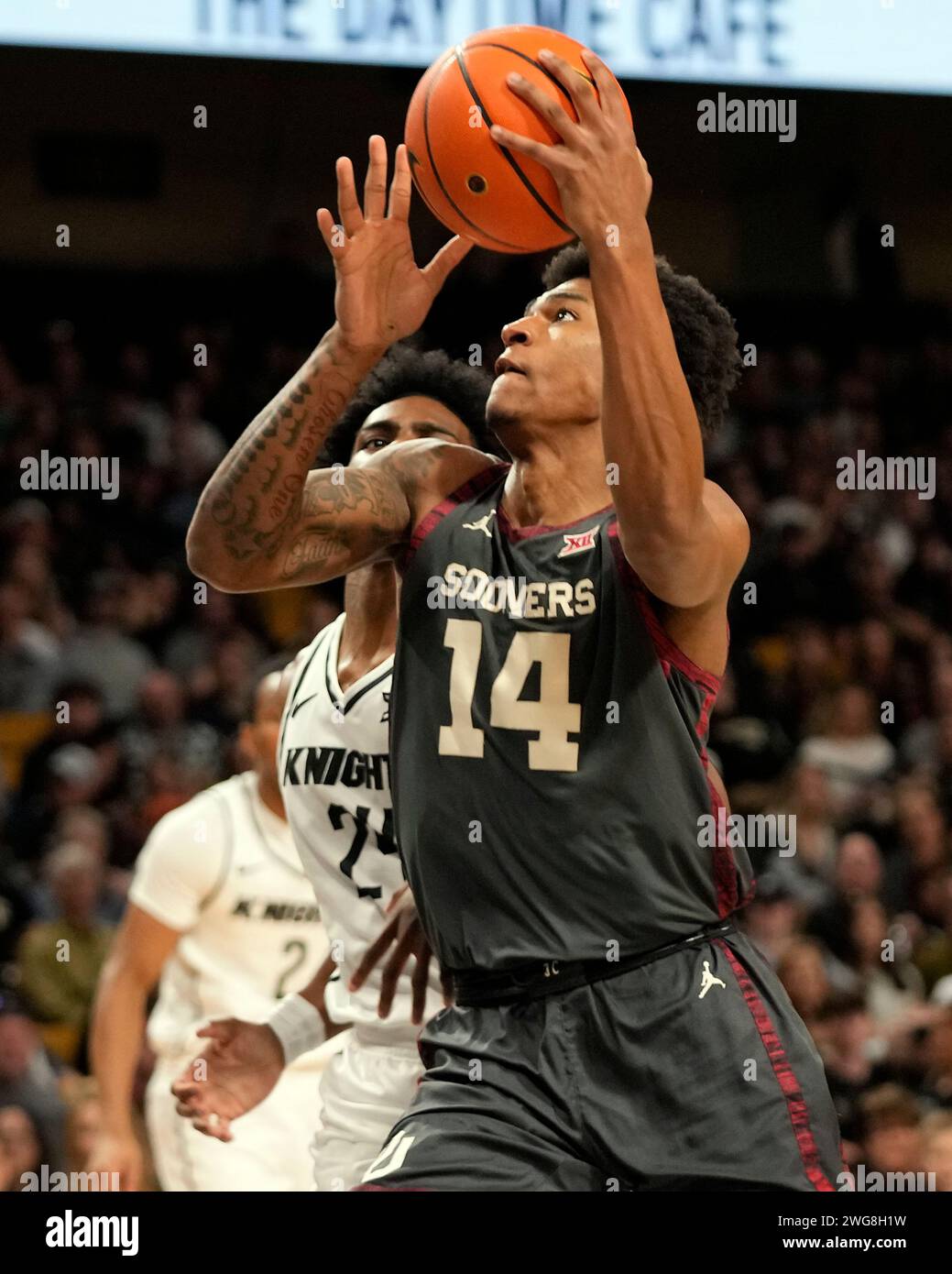 Oklahoma forward Jalon Moore (14) goes past Central Florida guard ...