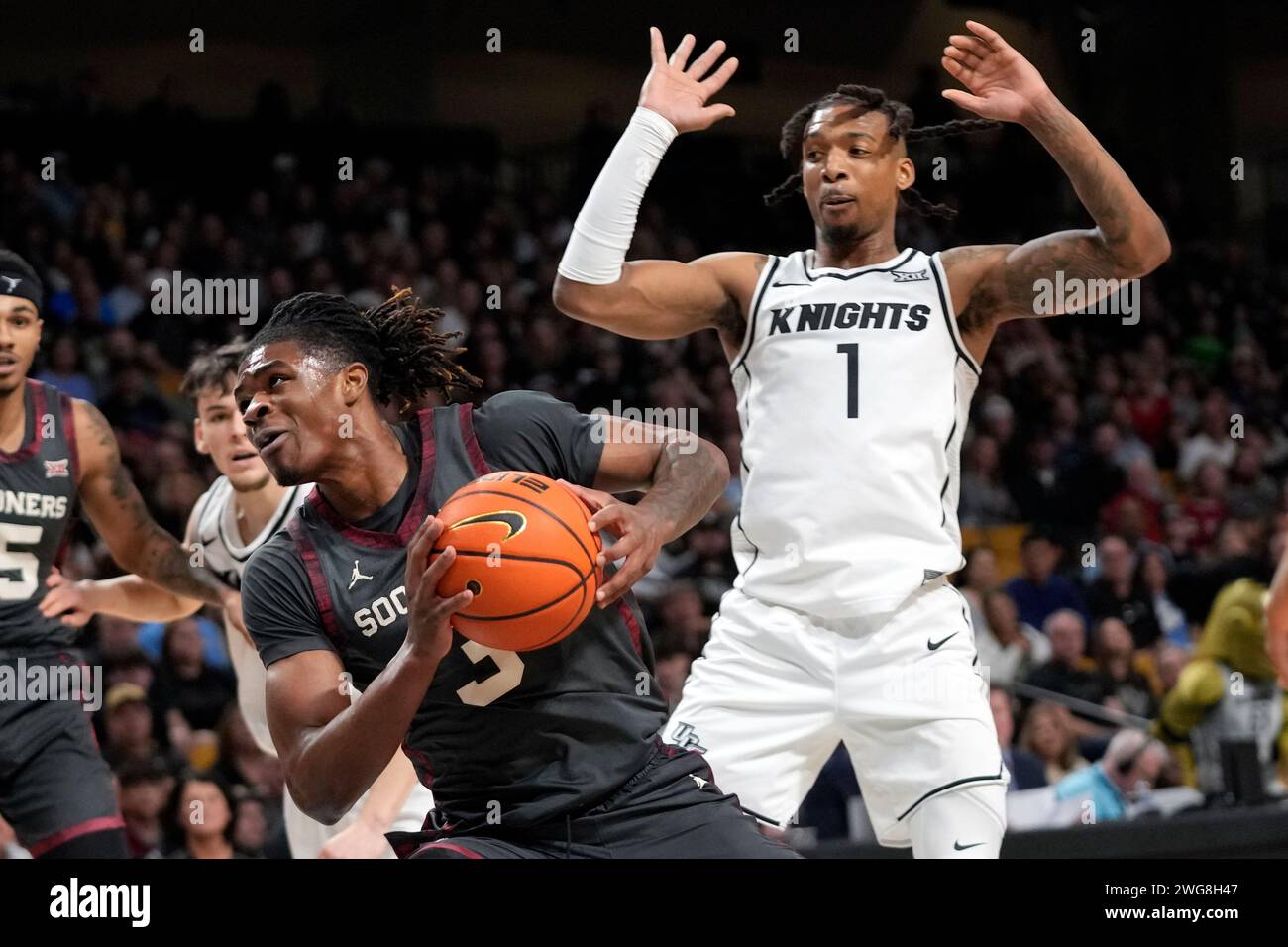 Oklahoma guard Otega Oweh, front left, goes past Central Florida guard ...