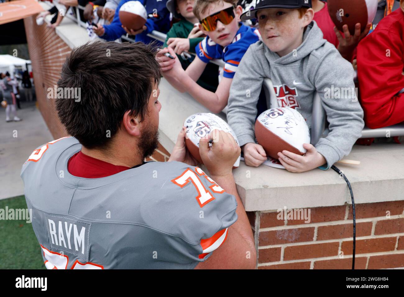 American offensive lineman Andrew Raym of Oklahoma (73) autographs a ...