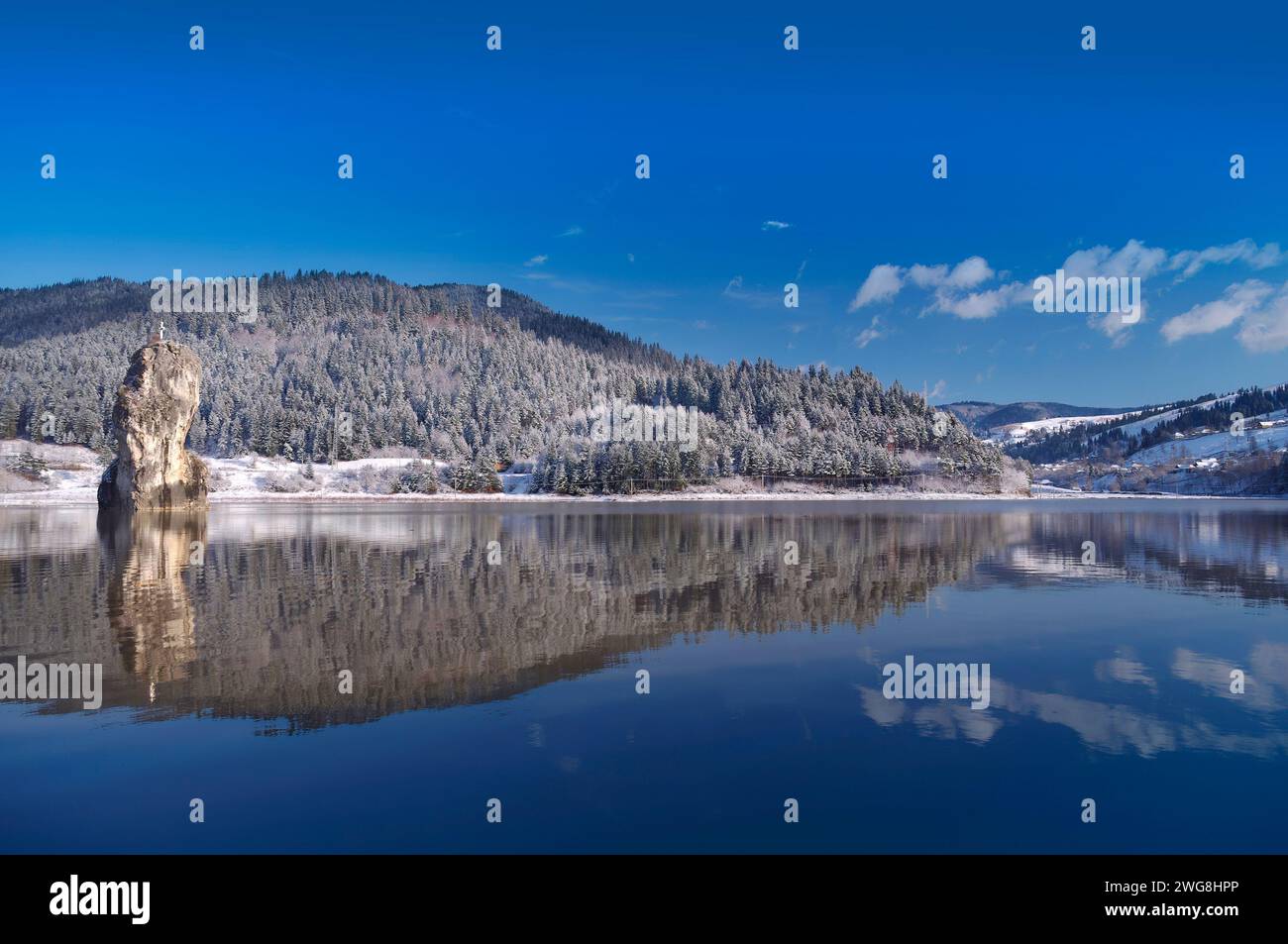 Rock in water. Piatra Teiului limestone in Bicaz lake, Romania Stock ...