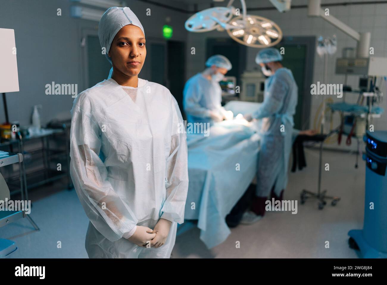 Portrait of serious African-American female nurse in surgical uniform ...
