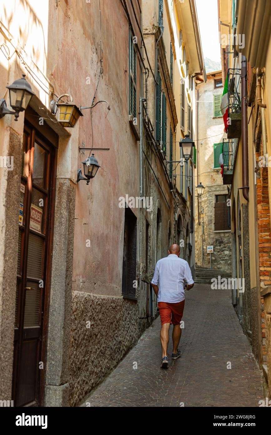 Man walking between buildings hi-res stock photography and images - Alamy