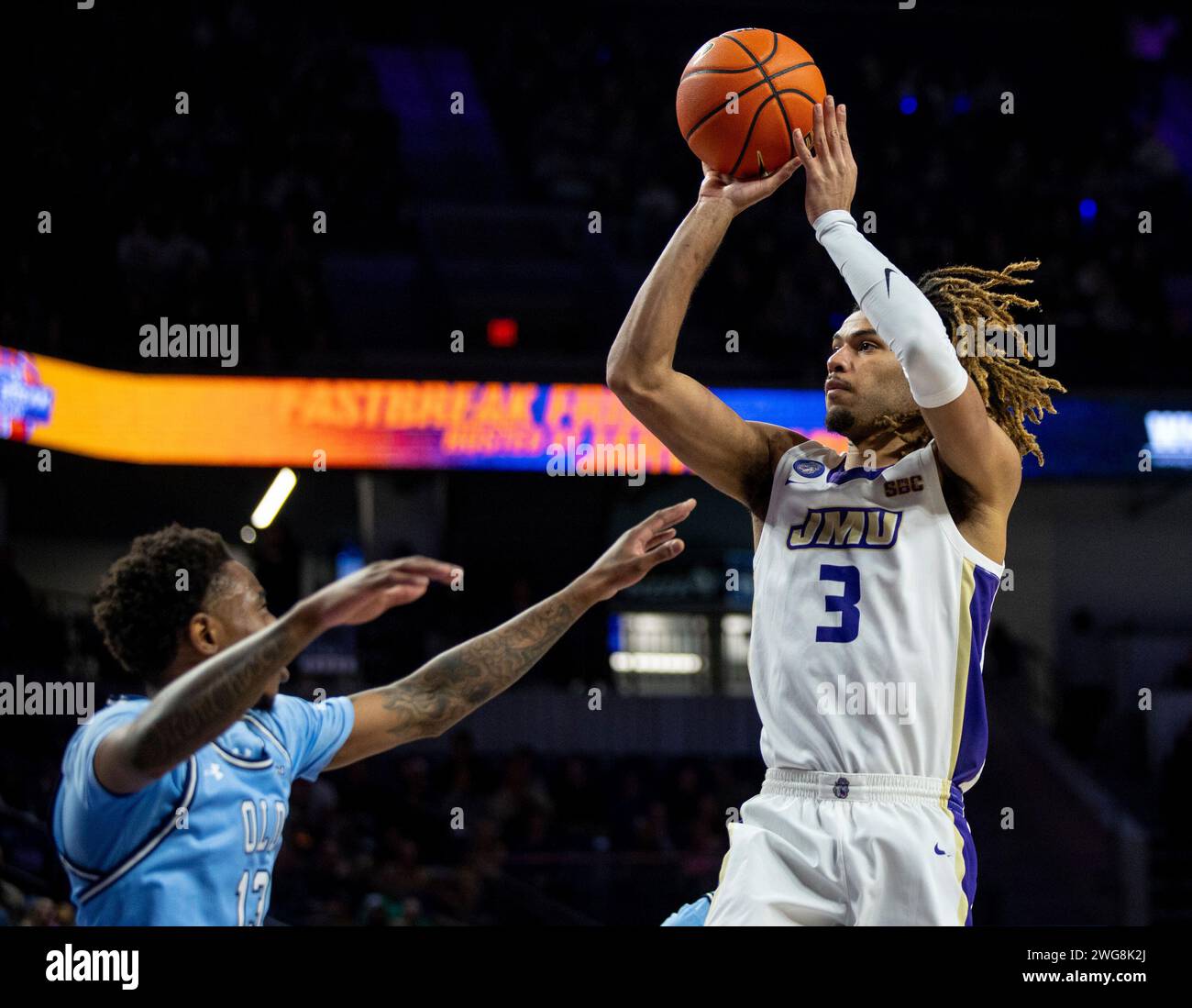 James Madison forward T.J. Bickerstaff (3) takes a shot over Old ...