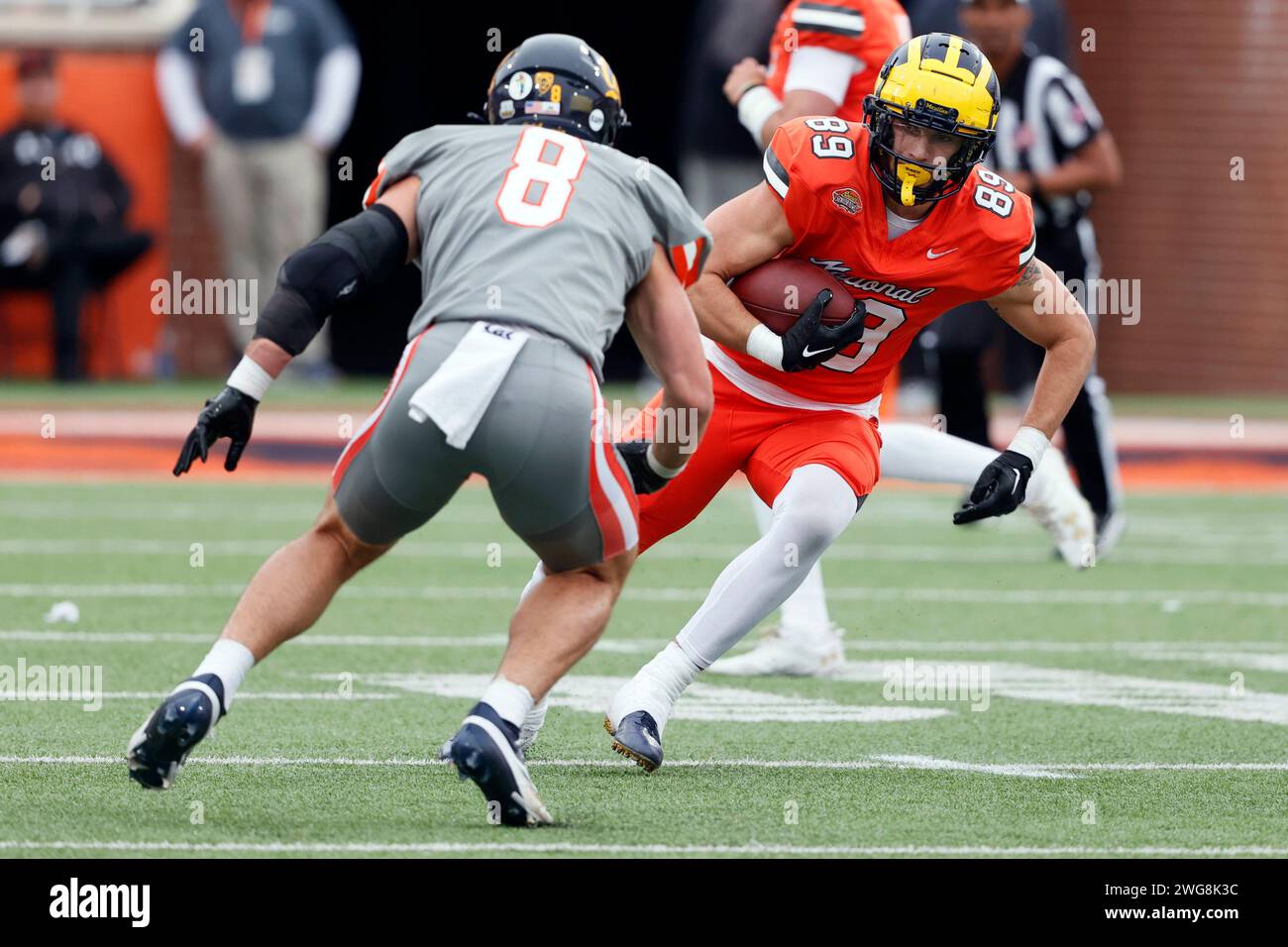 National tight end AJ Barner of Michigan (89) carries the ball after a ...