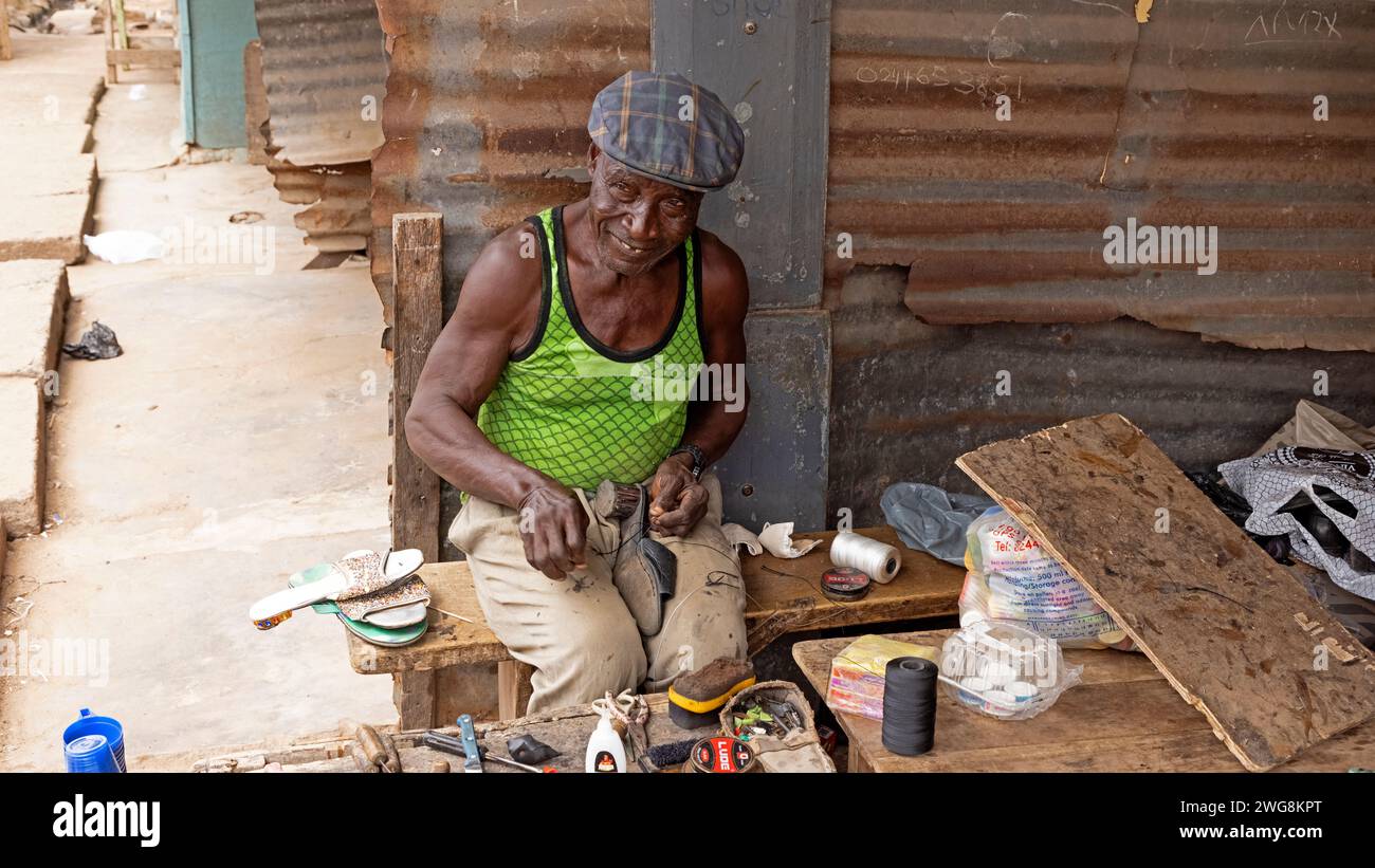 Shoe maker cobbler Nima Accra Ghana Africa poverty. Old Muslim shoe ...