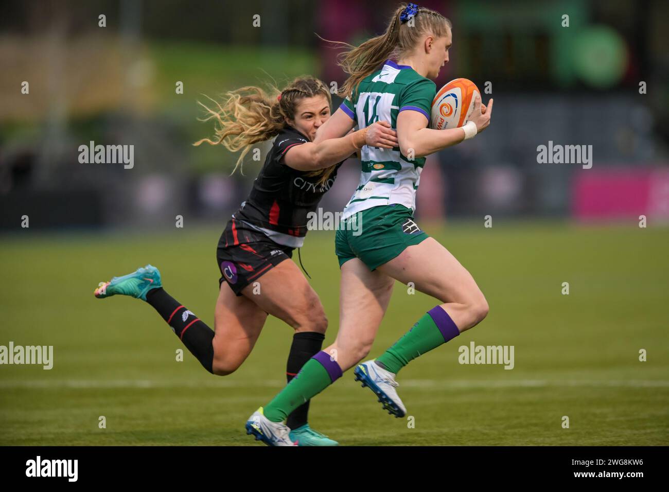 Vicky Laflin of Trailfinders Women is tackled by Sydney Gregson of ...
