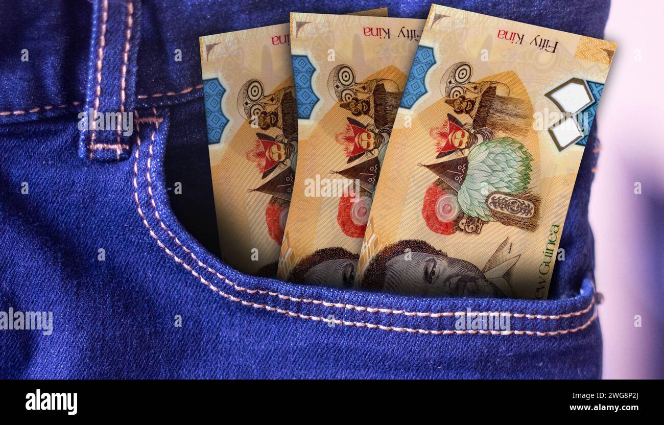 Bunch of Papua New Guinea 50 Kina banknotes in a jeans pocket a concept ...