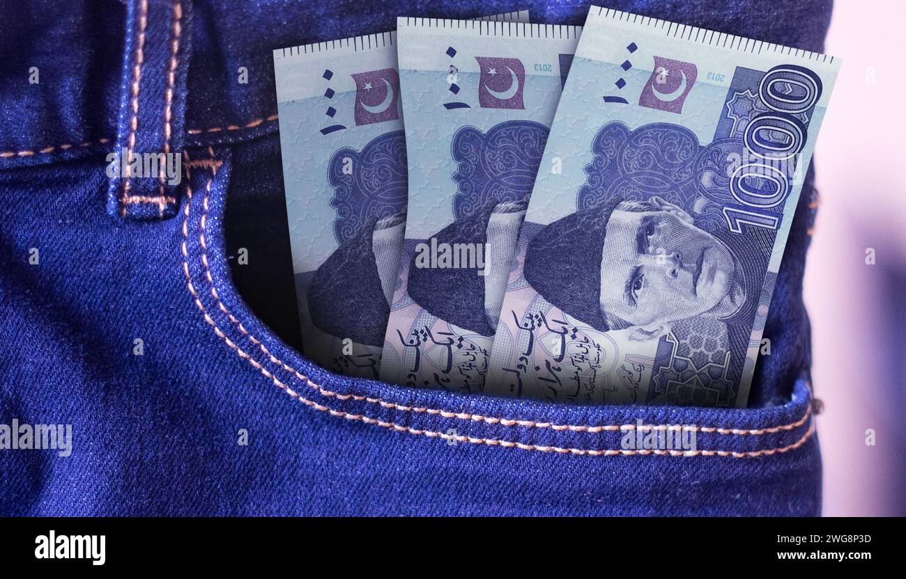 Bunch of 1000 Pakistan Rupee banknotes in a jeans pocket a concept of ...