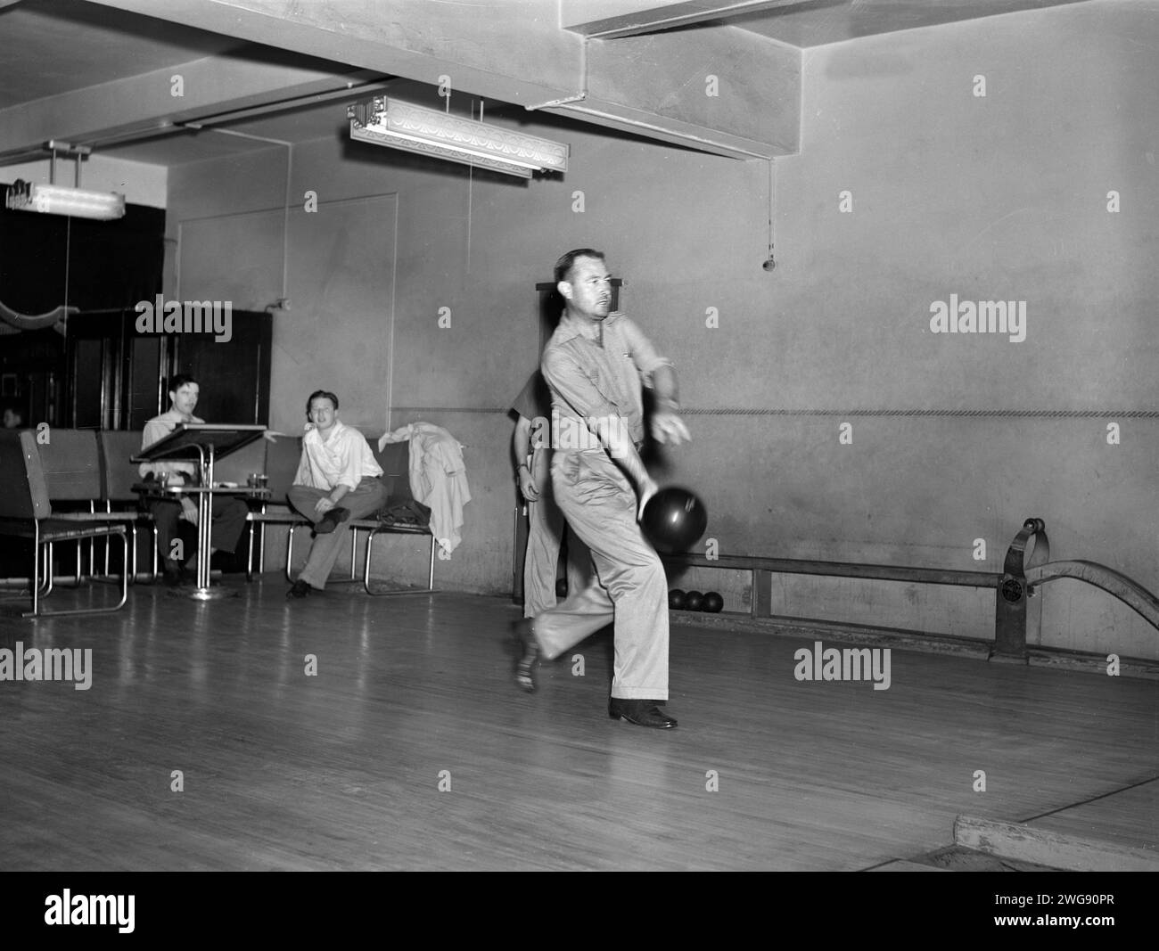 Man bowling at bowling alley, New York City, New York, USA, Marjory ...
