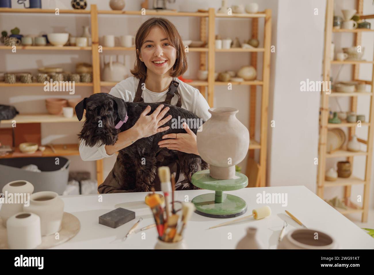 Smiling female artist sitting hi-res stock photography and images - Alamy