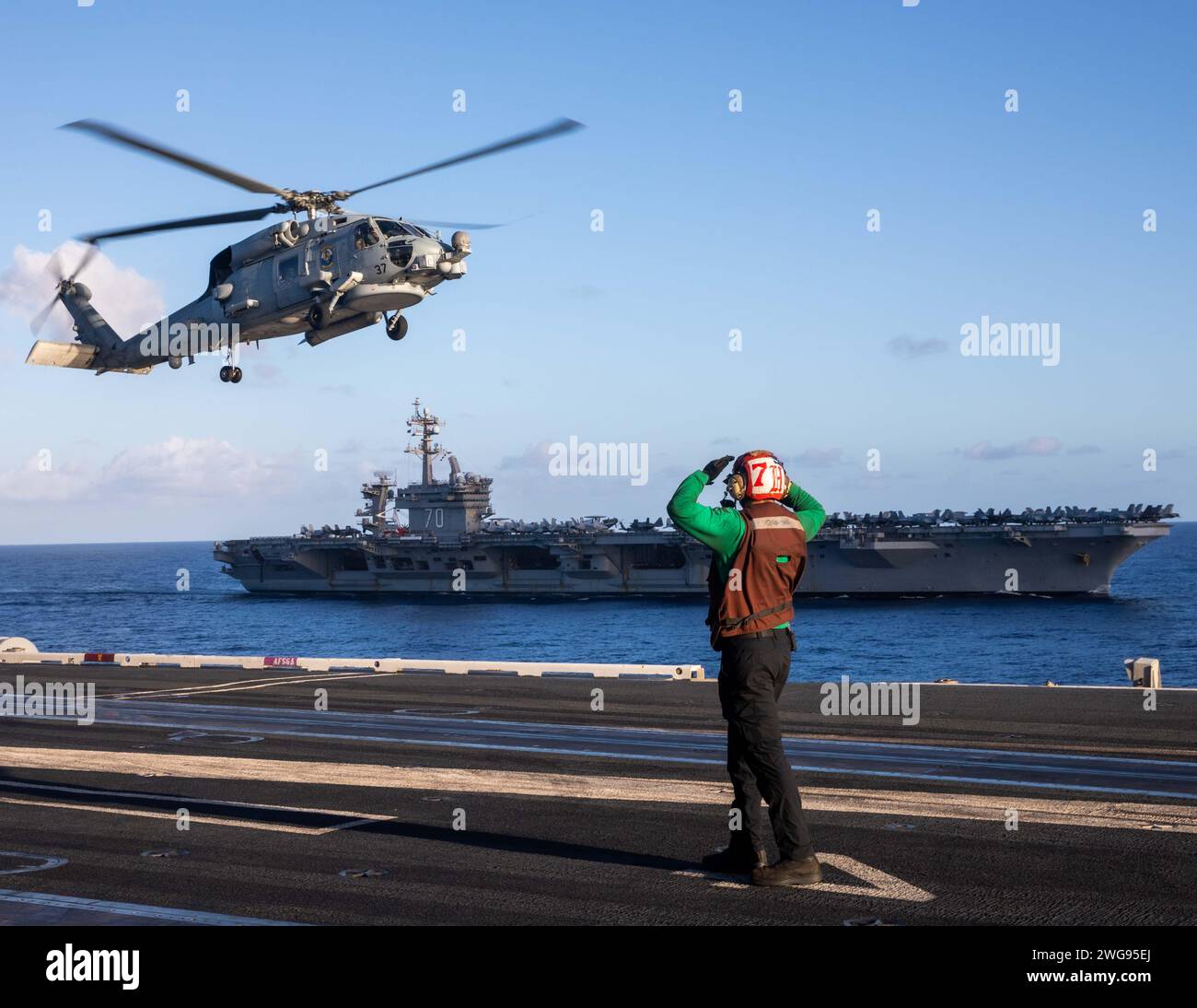 PHILIPPINE SEA (Feb. 2, 2024) An MH-60R Sea Hawk, assigned to the ...